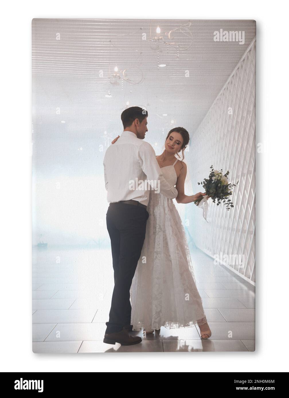 Photo printed on canvas, white background. Happy newlywed couple ...
