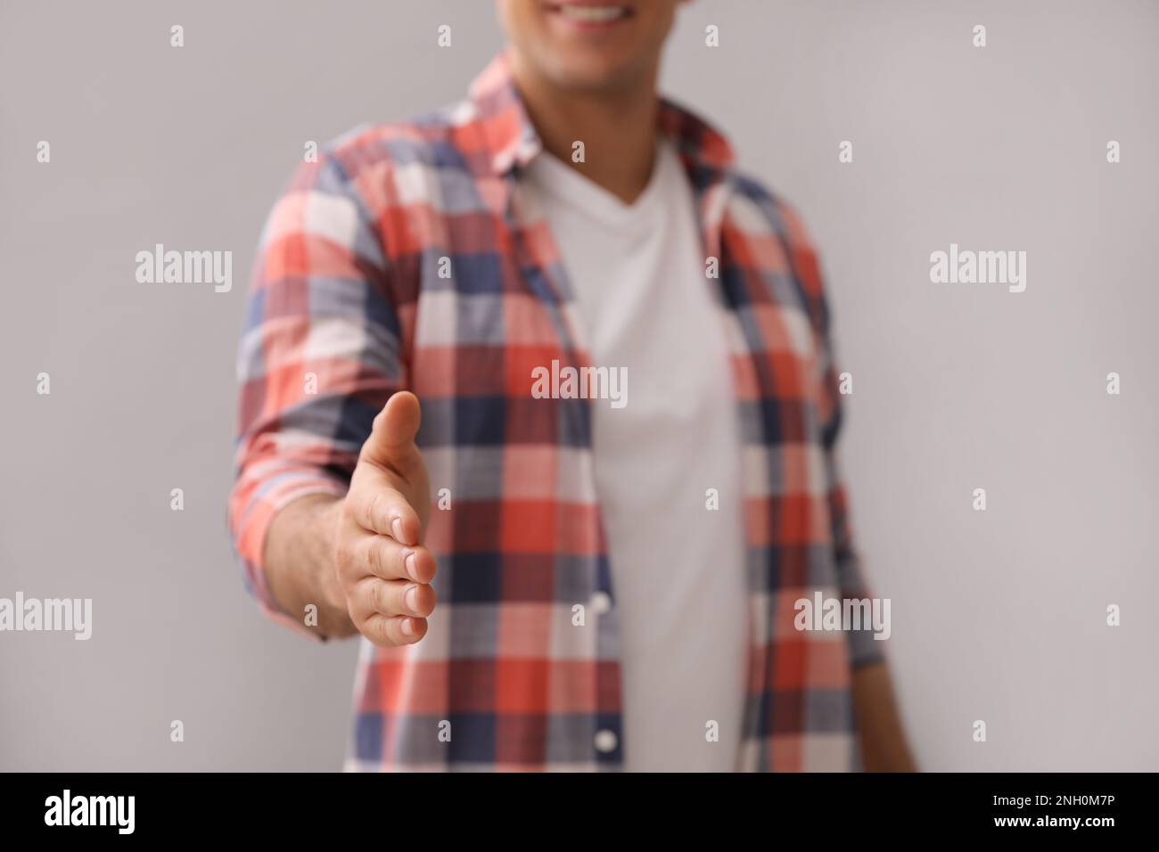 Casual man reaching out hand hi-res stock photography and images - Alamy