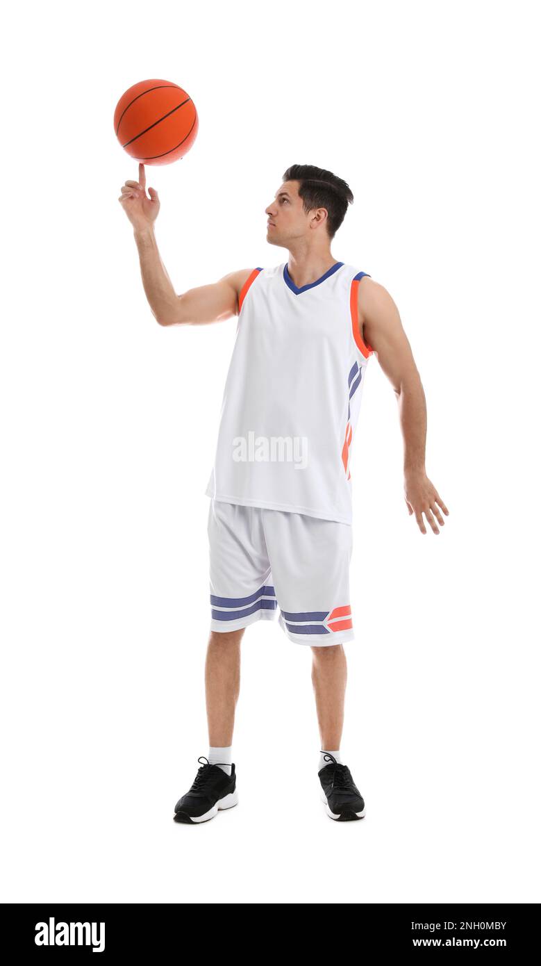 Basketball player spinning ball on finger against white background ...