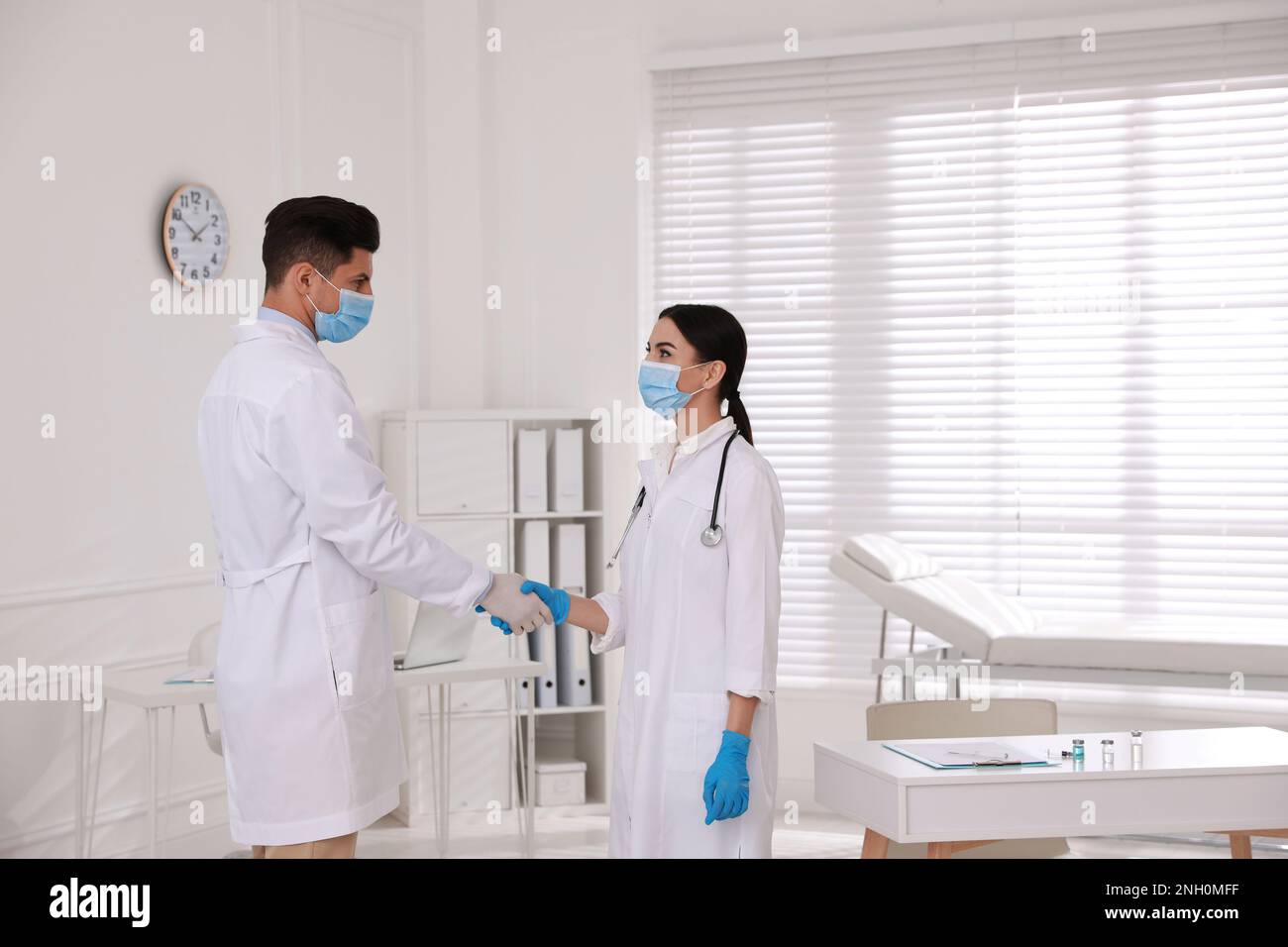 Surgical gloves handshake hi-res stock photography and images - Alamy
