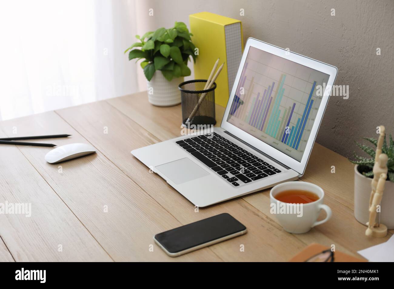 Stylish workplace with laptop on wooden desk. Interior design Stock ...