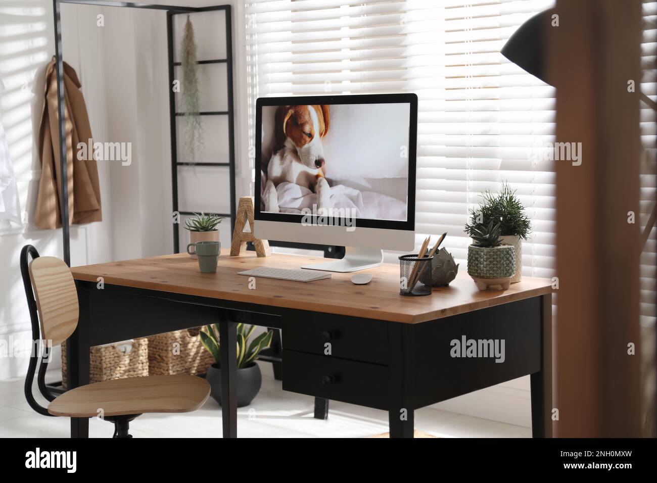 Stylish home office interior with comfortable workplace Stock Photo - Alamy