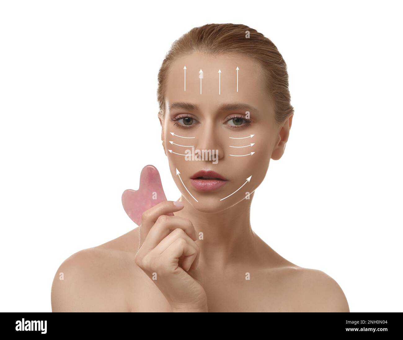 Beautiful young woman with gua sha tool on white background Stock Photo ...