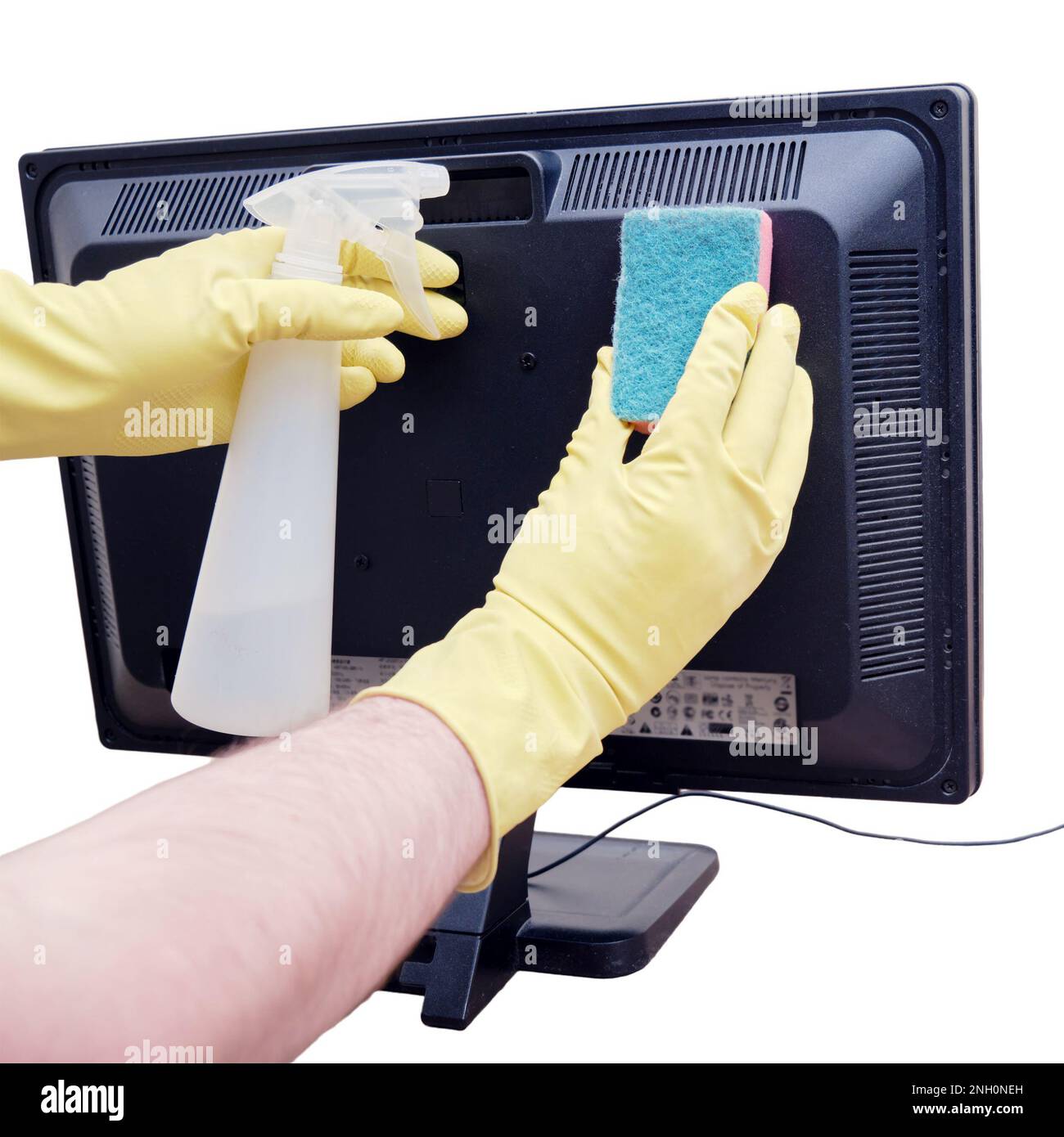 Cleaning the office, a janitor in yellow gloves wipes monitor and ...