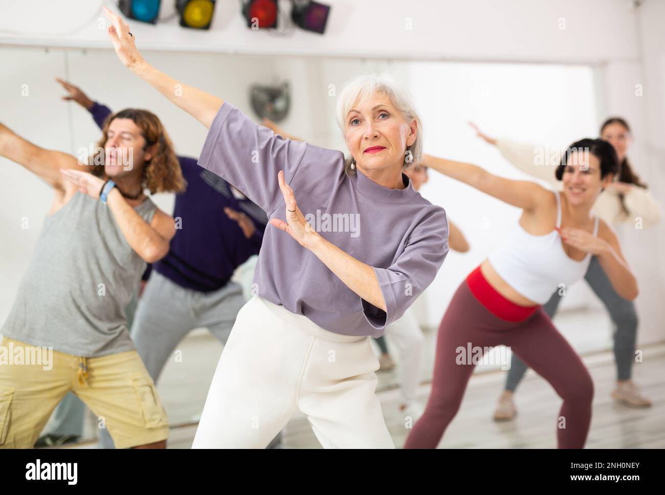 Group of adult people practices dance aerobics Stock Photo - Alamy