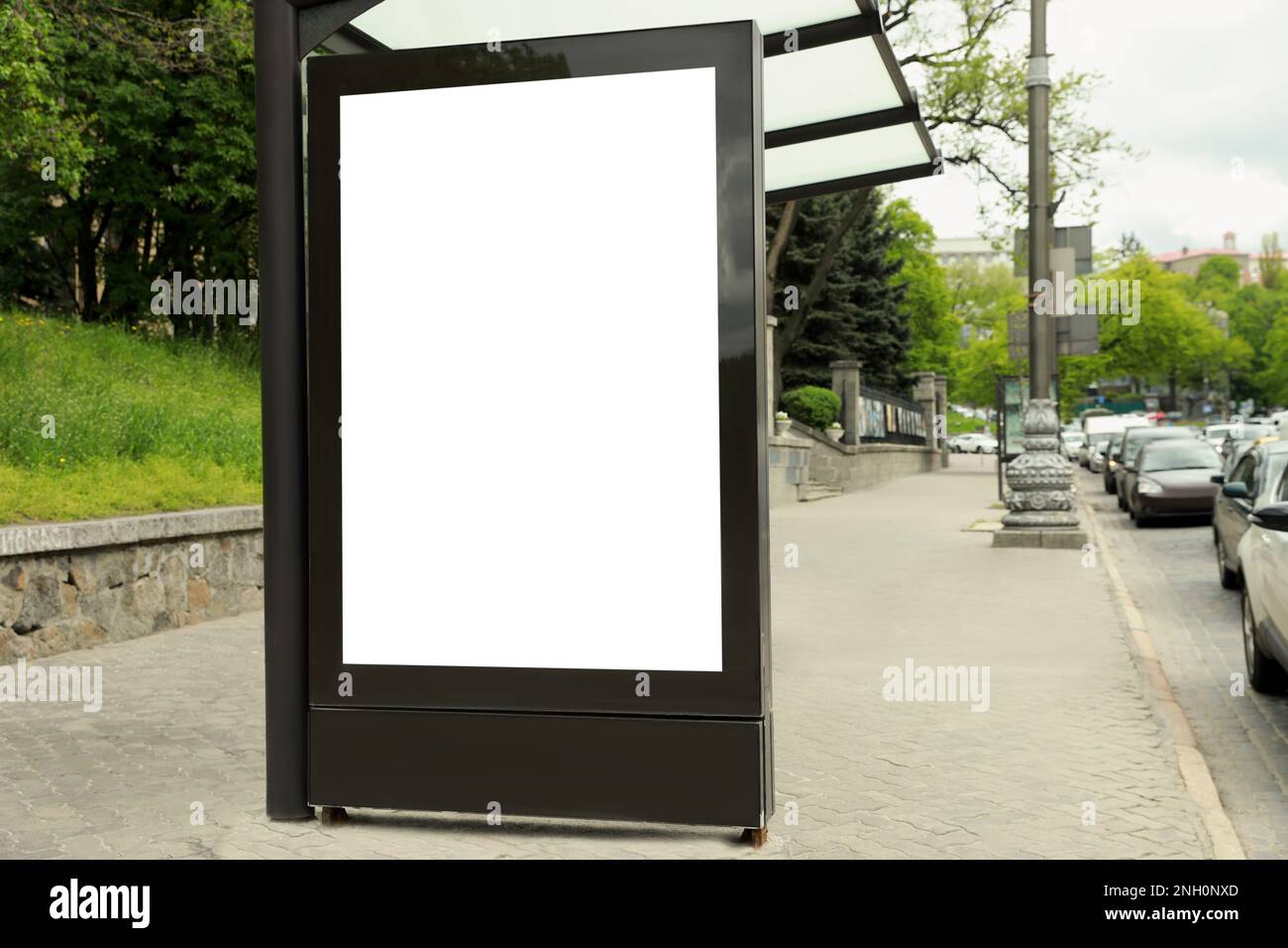 Blank advertising board on bus stop. Space for design Stock Photo - Alamy