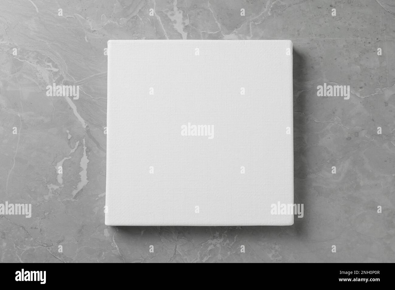 Blank canvas on grey marble table, top view. Space for text Stock Photo ...