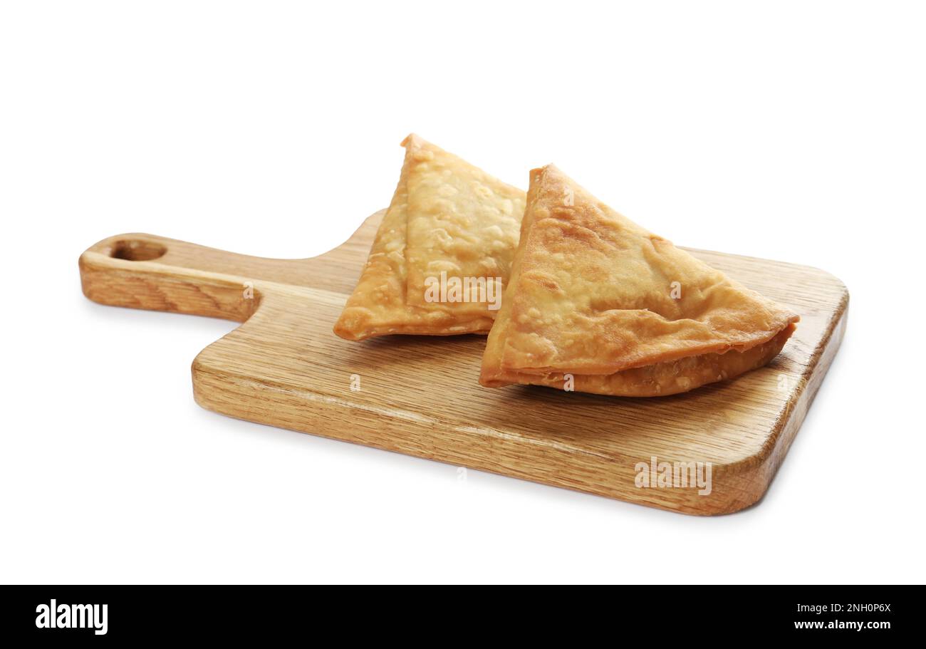 Fresh delicious crispy samosas on white background Stock Photo - Alamy