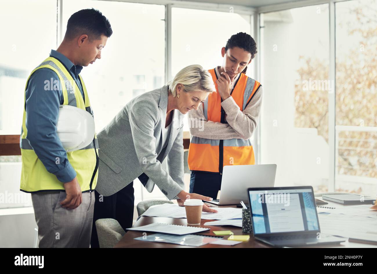 Engineering, teamwork and planning with blueprint in office for ...