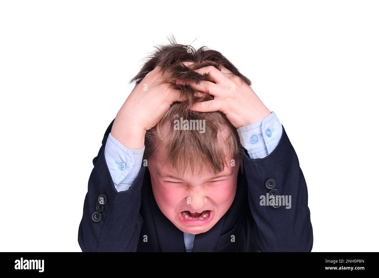 A scared boy in a school suit on distance learning, isolated on a white ...