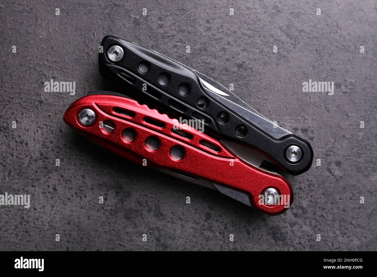 Modern compact portable multitool on grey table, top view Stock Photo ...