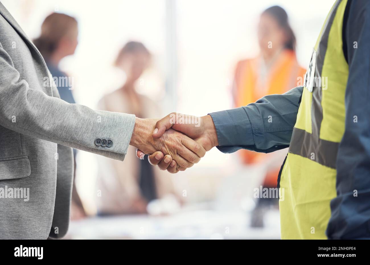 Teamwork, partnership and engineering with handshake of people in ...