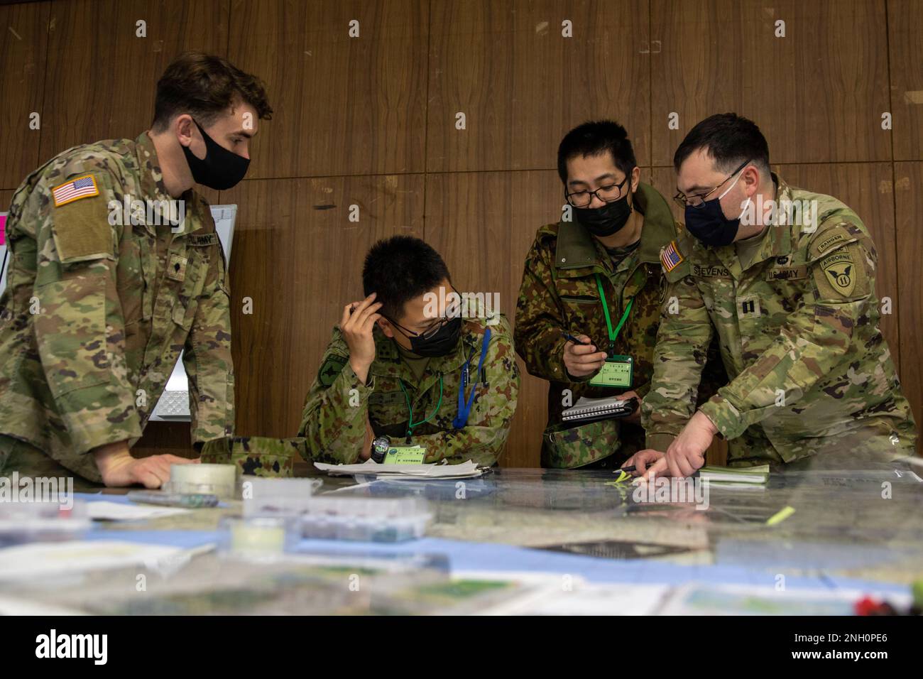 Soldiers assigned to 1st Brigade 11th Airborne Division, discuss plans ...