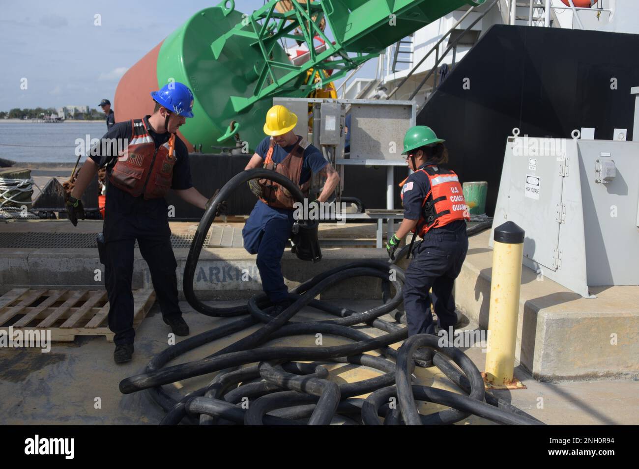 U.S. Coast Guardsmen from the coastal buoy tender USCGC Maria Bray (WLM ...
