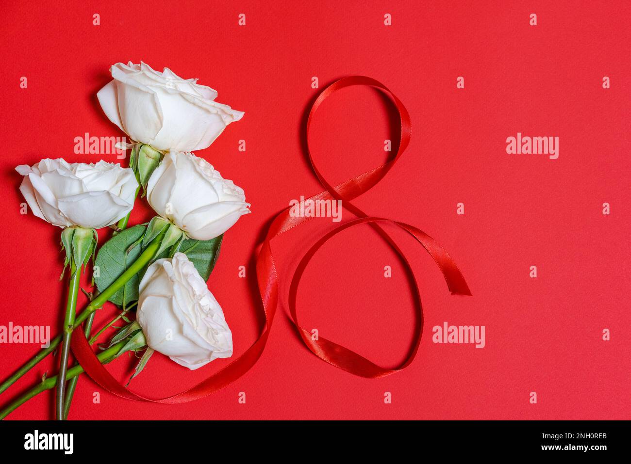 Greeting card for women's day March 8, number eight from red ribbons ...