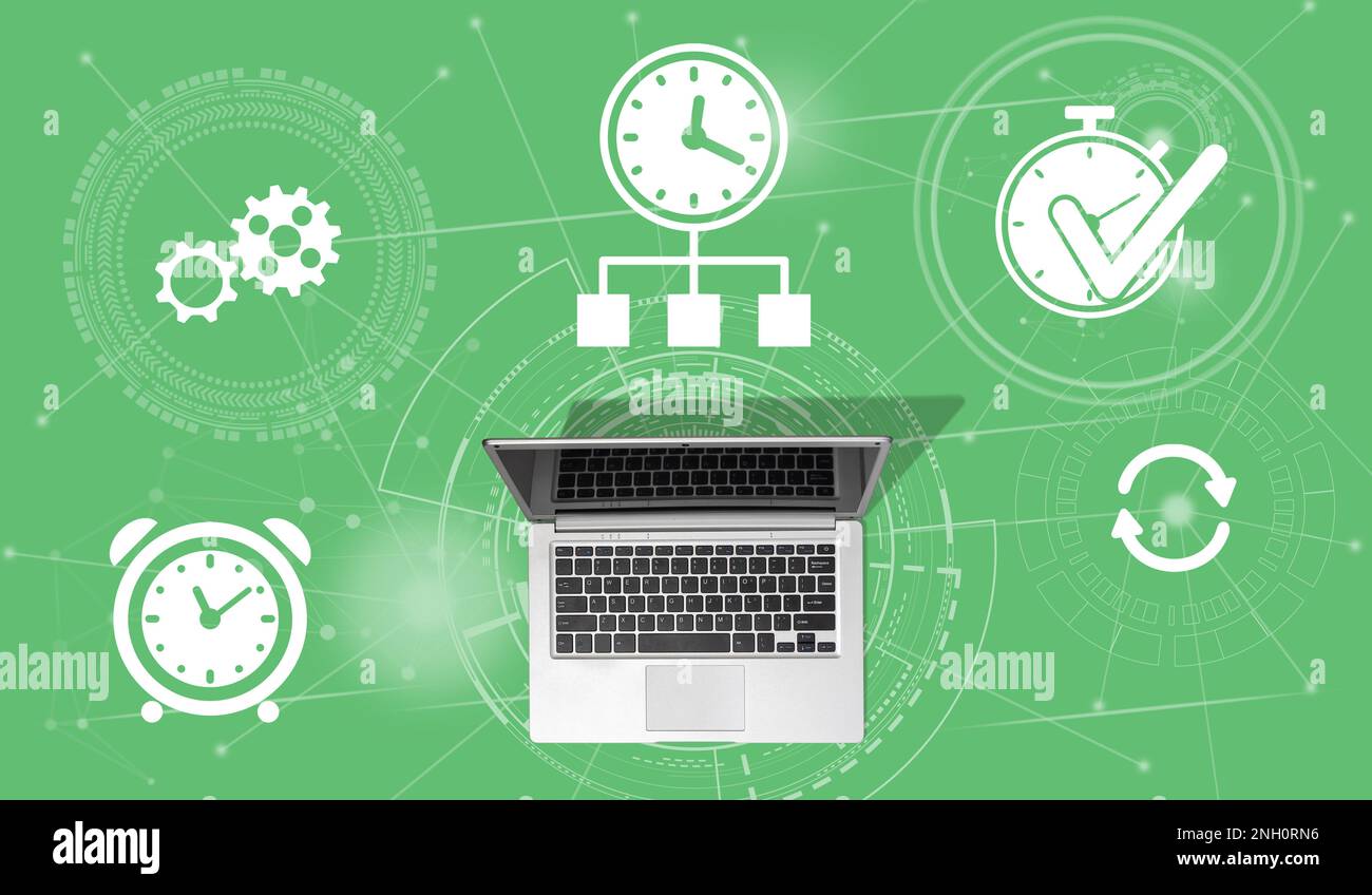 Top view of laptop with symbol of time management concept Stock Photo ...