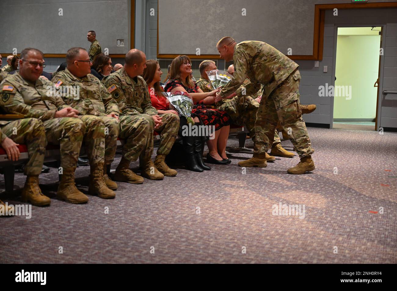 Flowers are presented to the wives of the command chief warrant ...