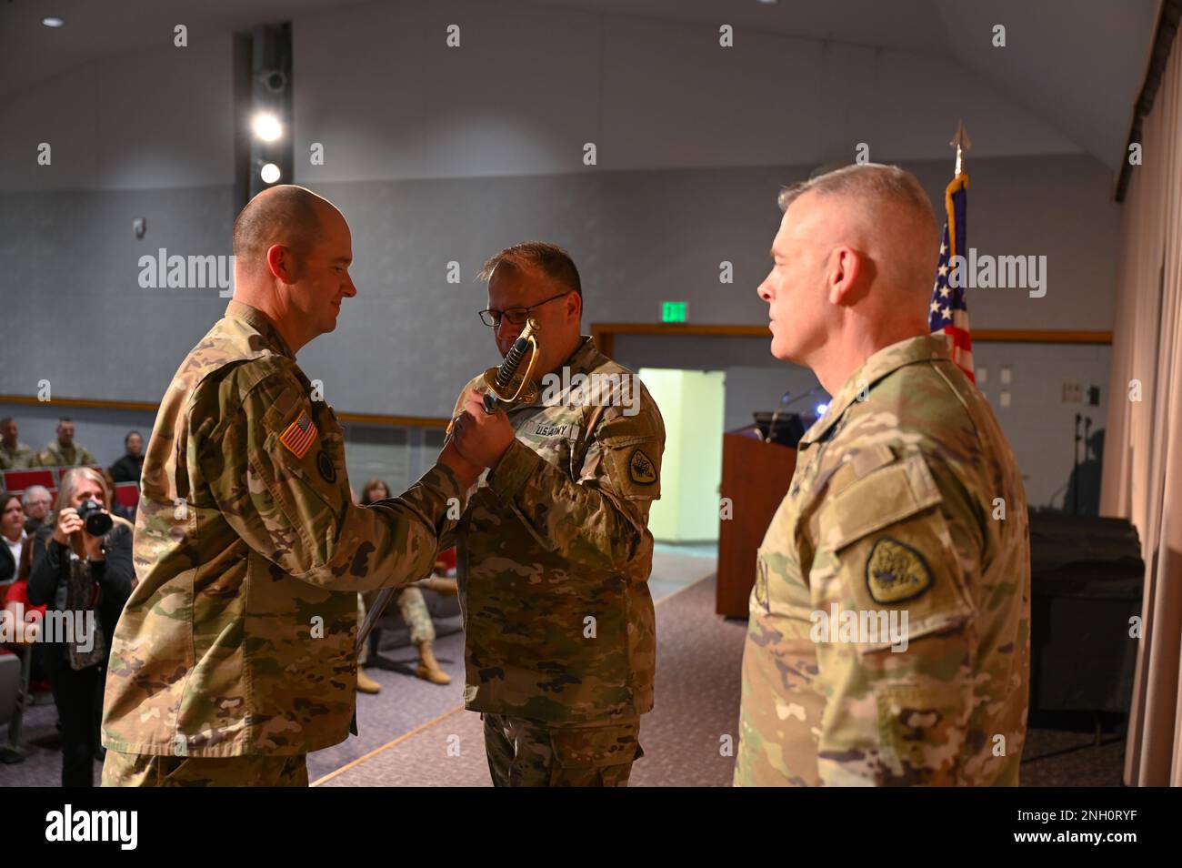Command Sgt. Maj. Spencer Nielsen passes the saber to Command Chief ...