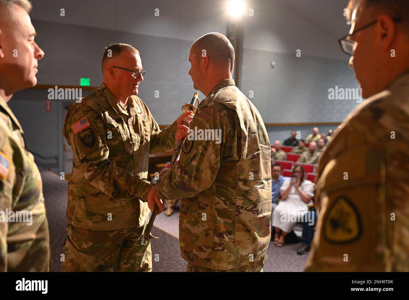 Command Chief Warrant Officer 5 William Erickson passes the saber back ...