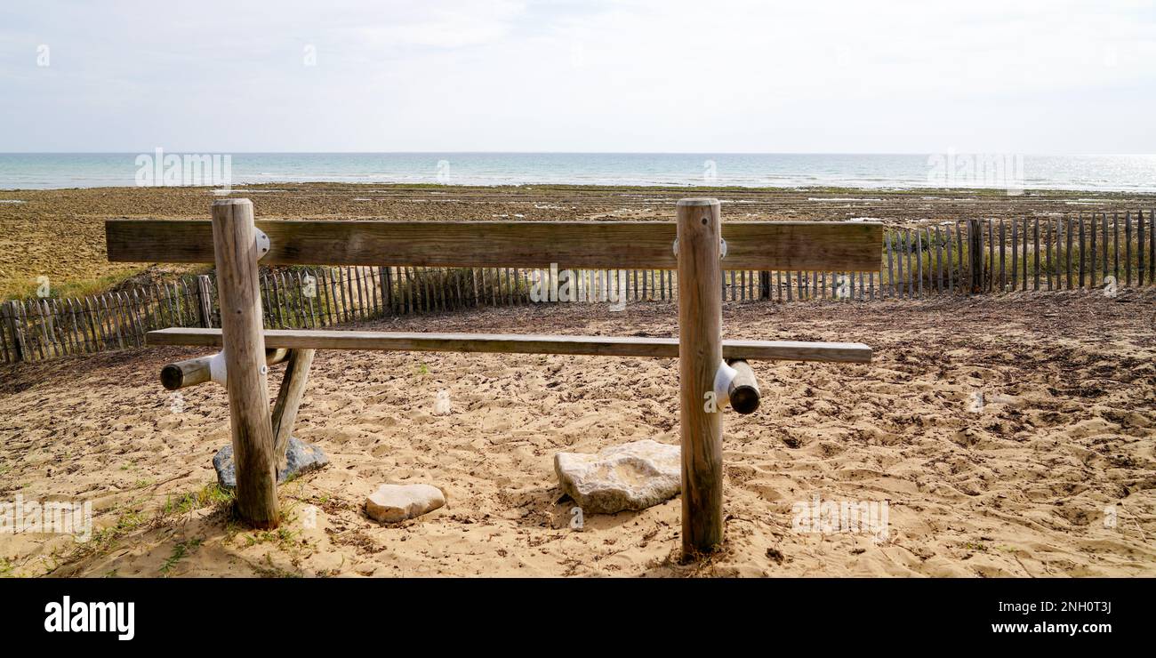 single wood bench empty in Atlantic coast in Jard sur Mer Vendée France ...