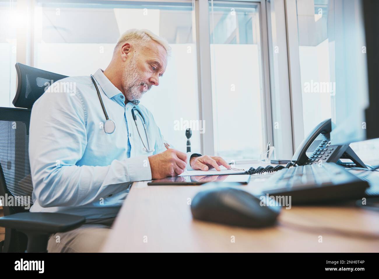 Research, senior man doctor writing in notebook for healthcare ...
