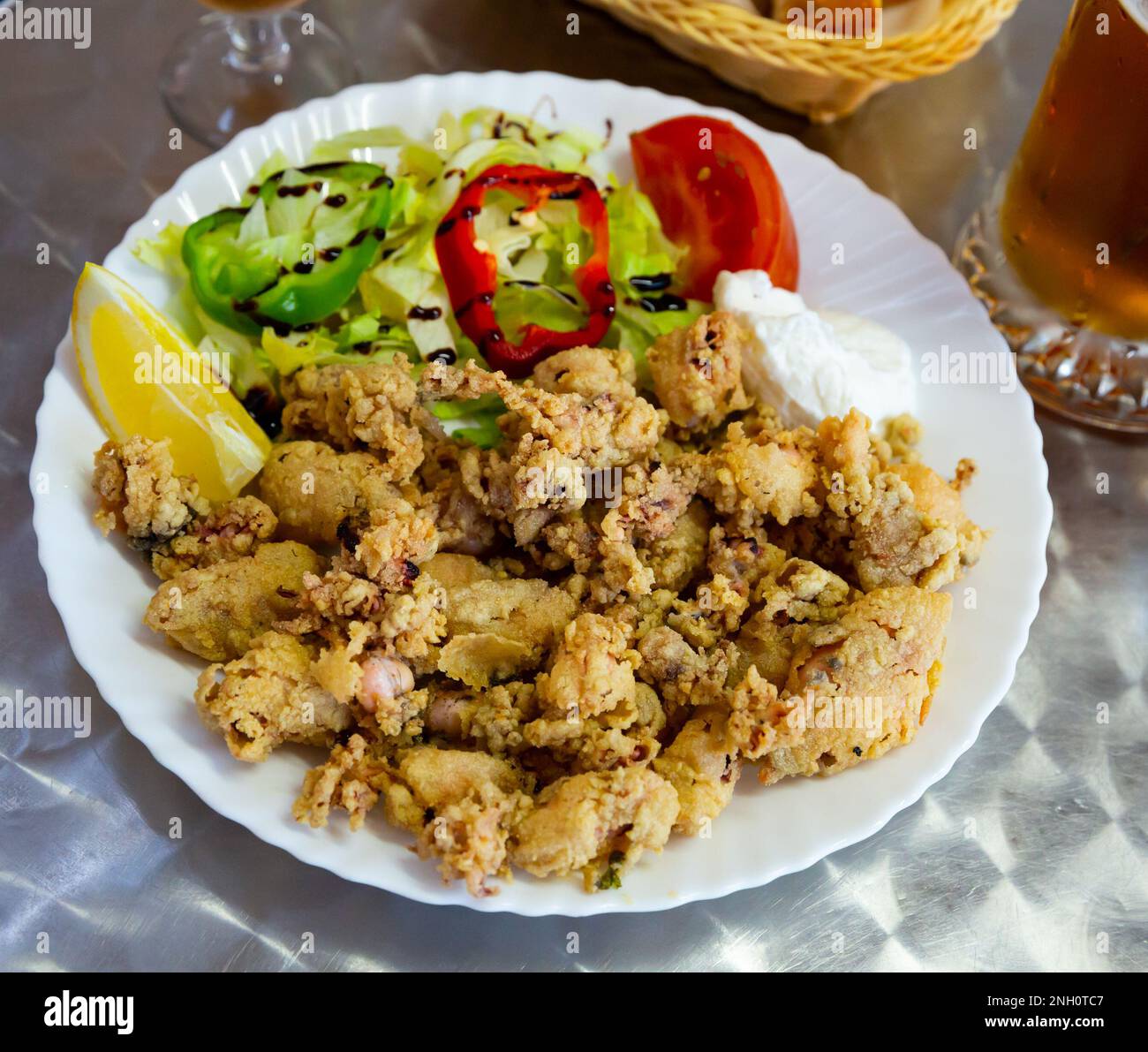 Chipirones battered fried baby squid Stock Photo - Alamy