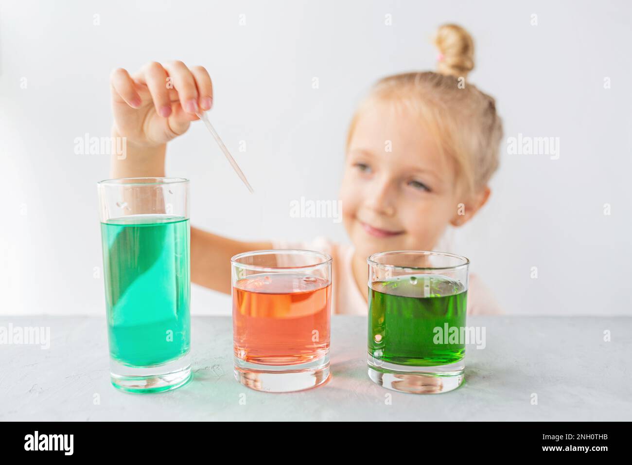 cute little girl six years old doing laboratory experiment with ...