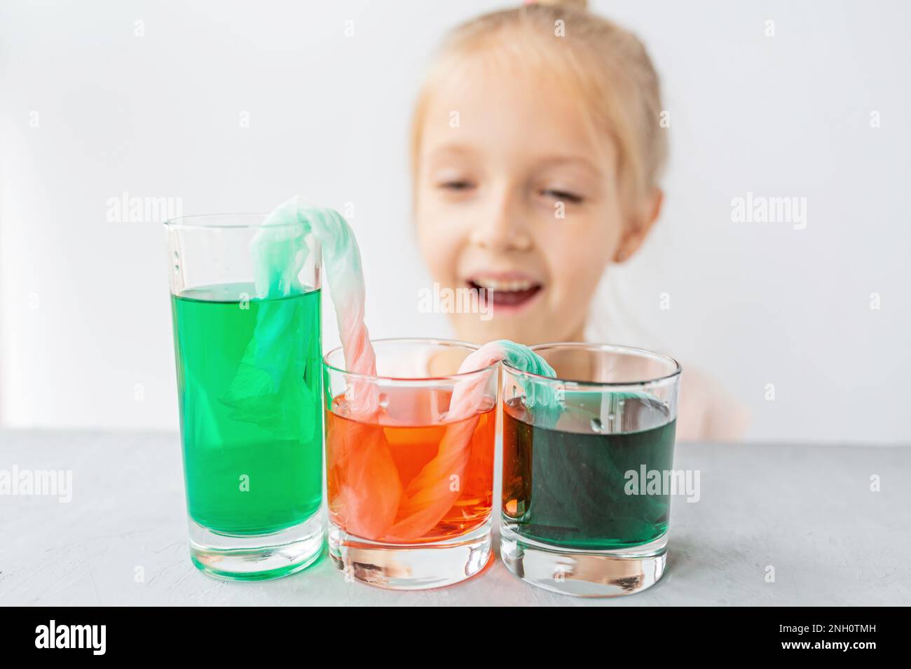 cute little girl six years old doing laboratory experiment with ...