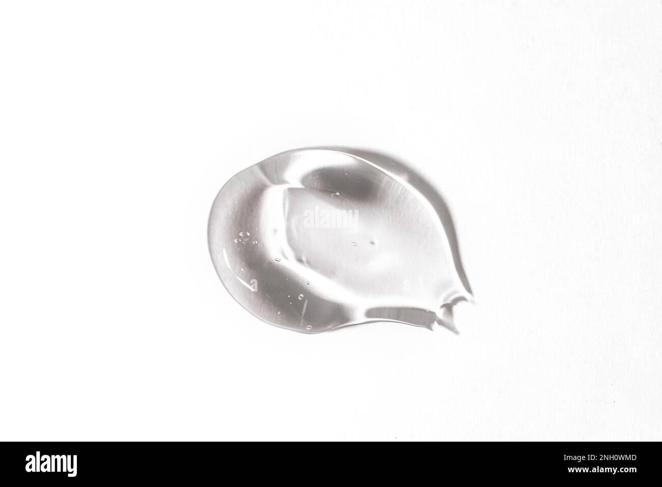 Cosmetic lotion transparent gel drop texture on blue background Stock ...