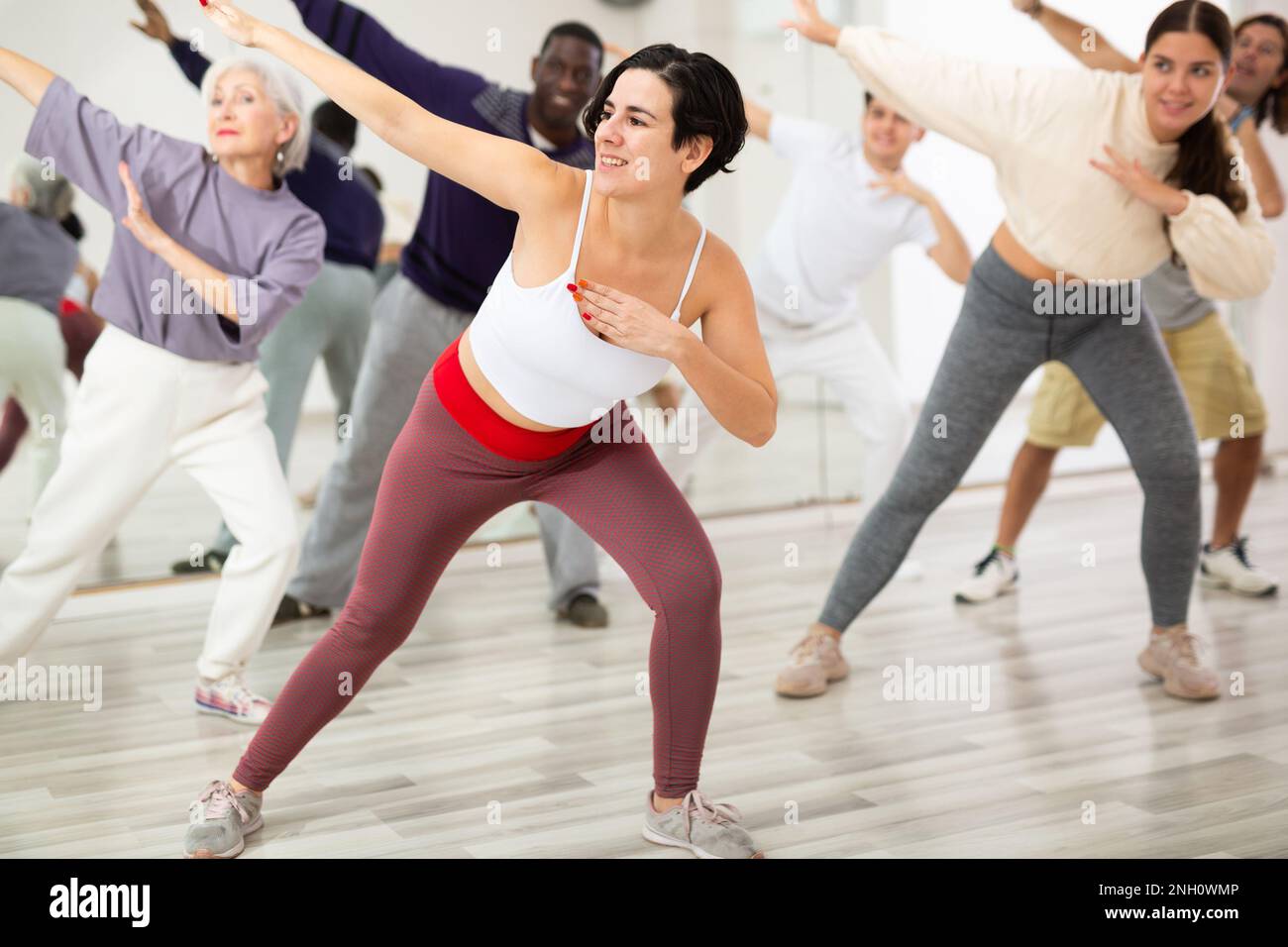 Group of adult people practices dance aerobics Stock Photo - Alamy