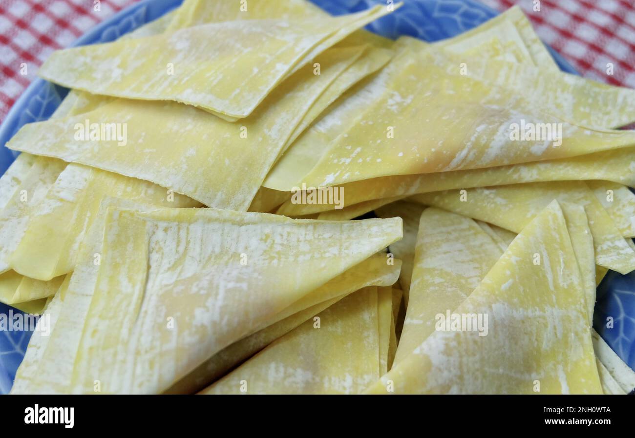 Fresh Wonton Wrappers Filled with Marinated Pork, Ready to be Deep ...