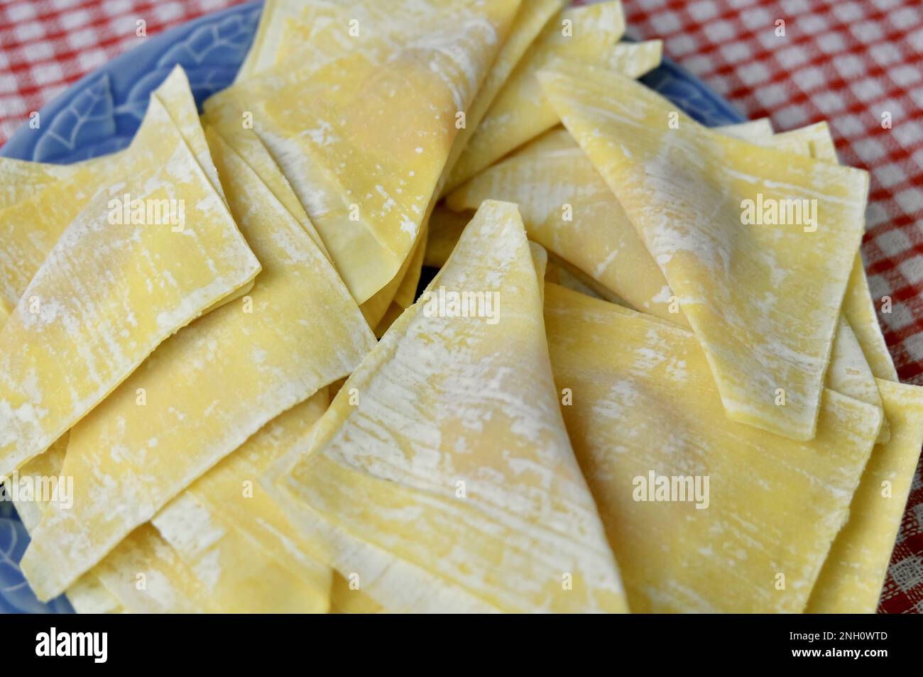 Fresh Wonton Wrappers Filled with Marinated Pork, Ready to be Deep ...