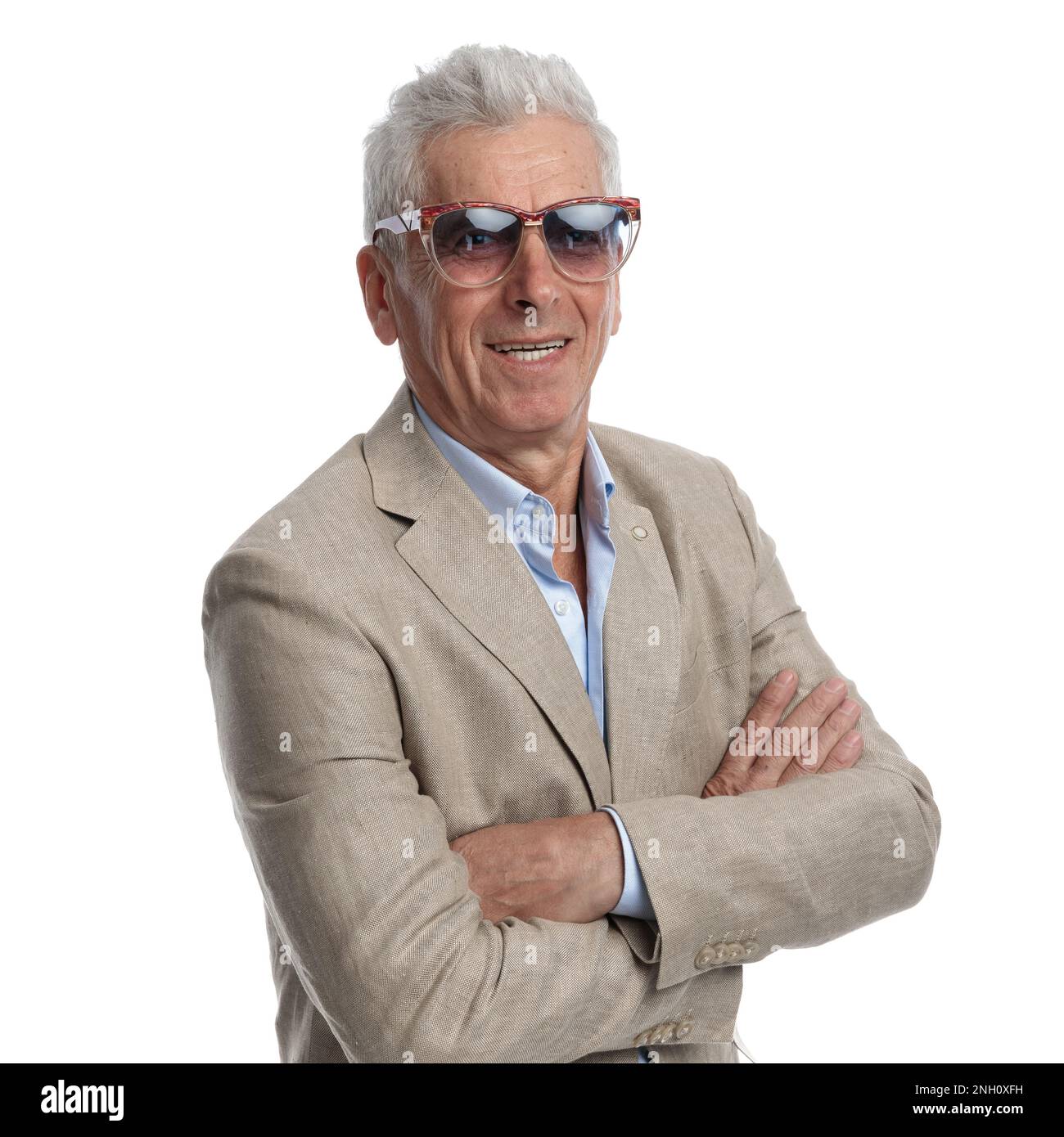 fashion man in his 60s in elegant suit with open collar shirt wearing ...