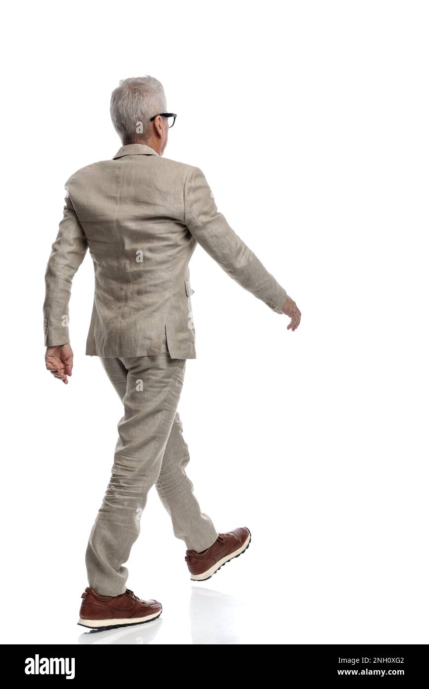 Man In Suit Walking Back View
