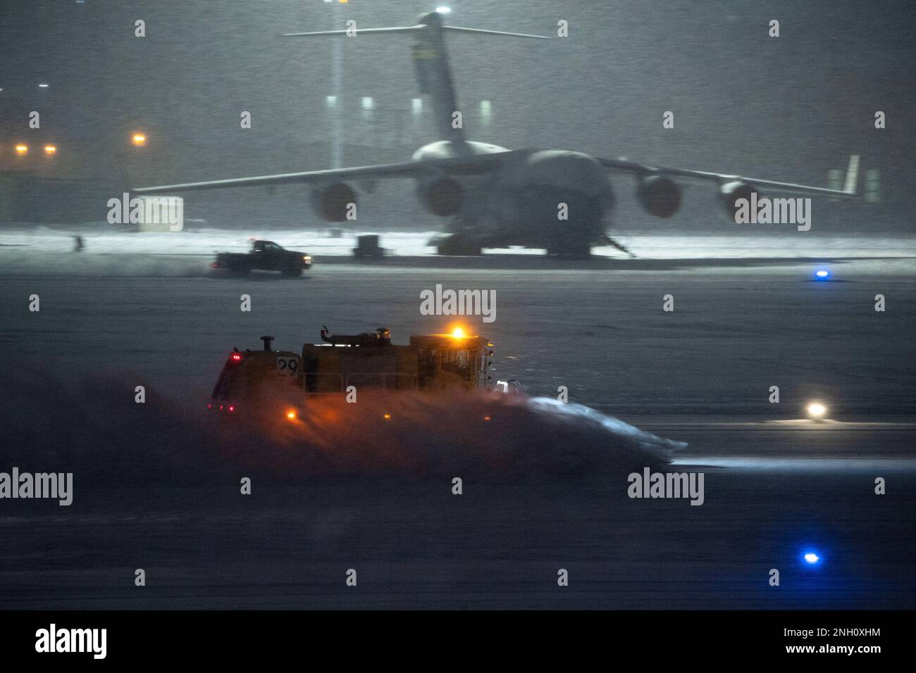 A U.S. Air Force snow plow operator assigned to the 773rd Civil ...