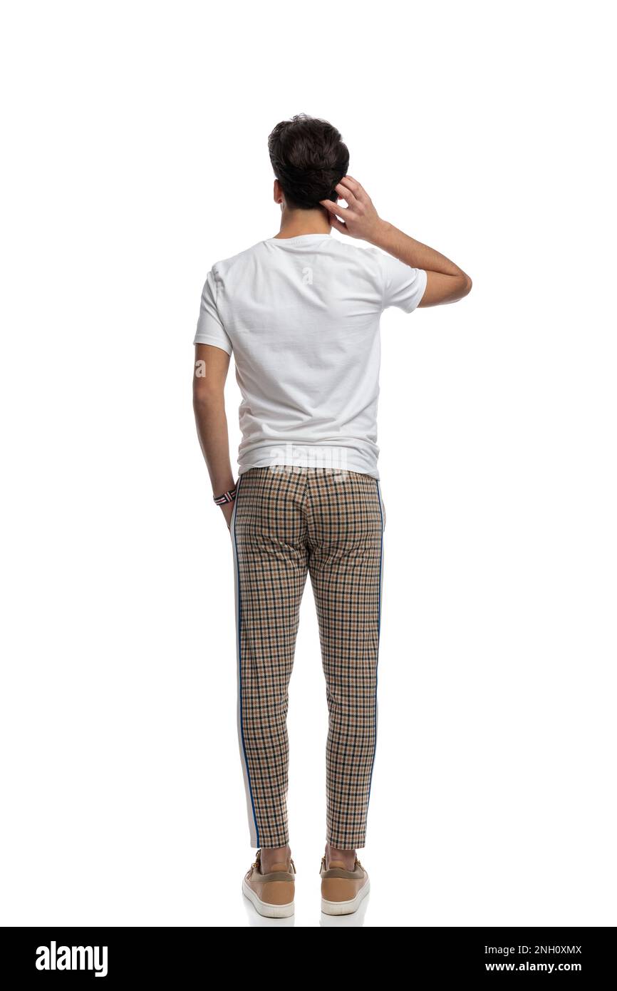 confused young man scratching head and thinking of ways to solve ...