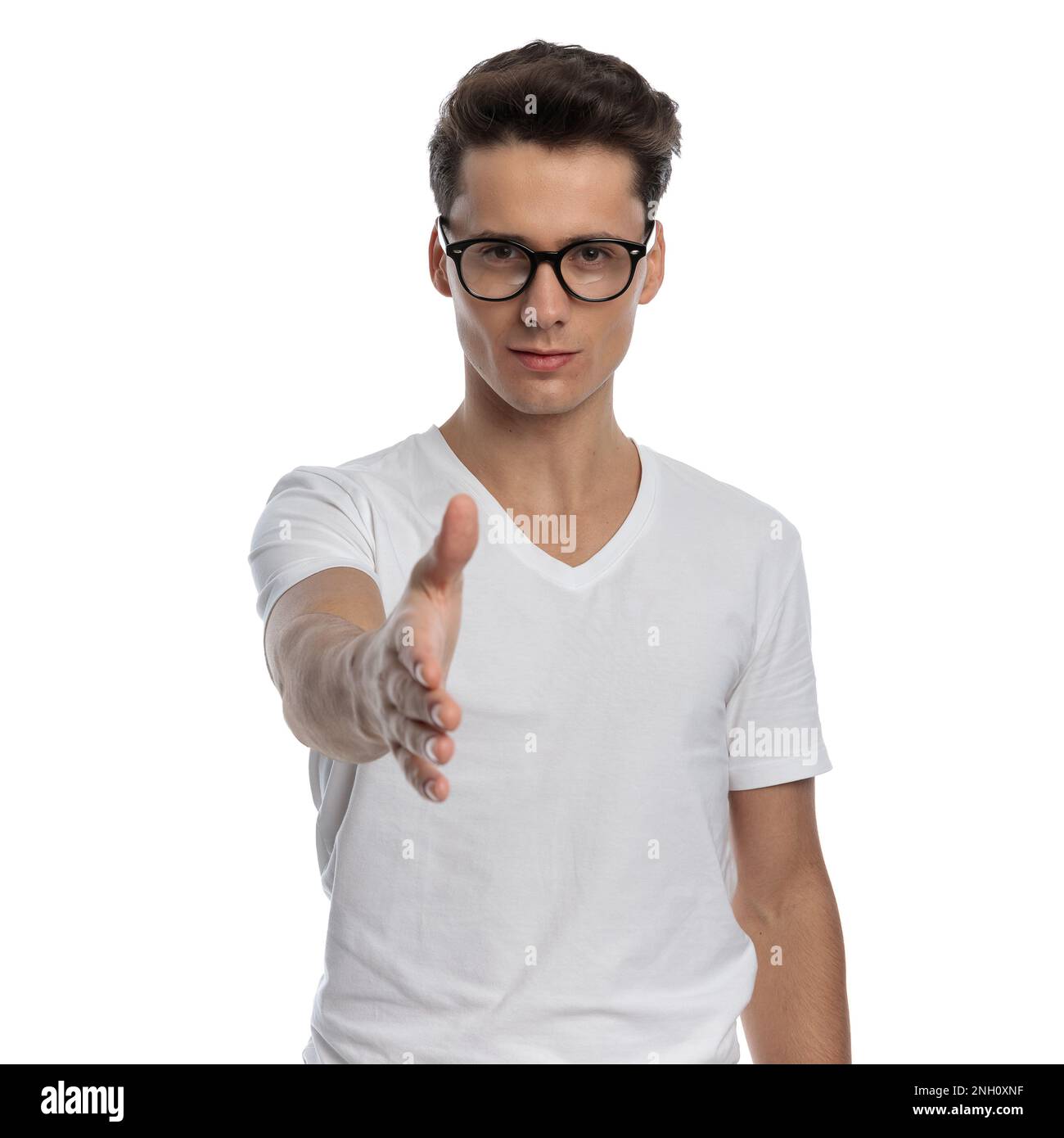 handsome young guy with glasses holding and shaking hand in front of ...