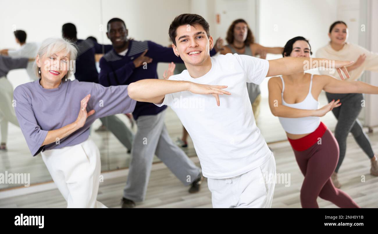 Group of dancing people practicing energetic swing Stock Photo - Alamy