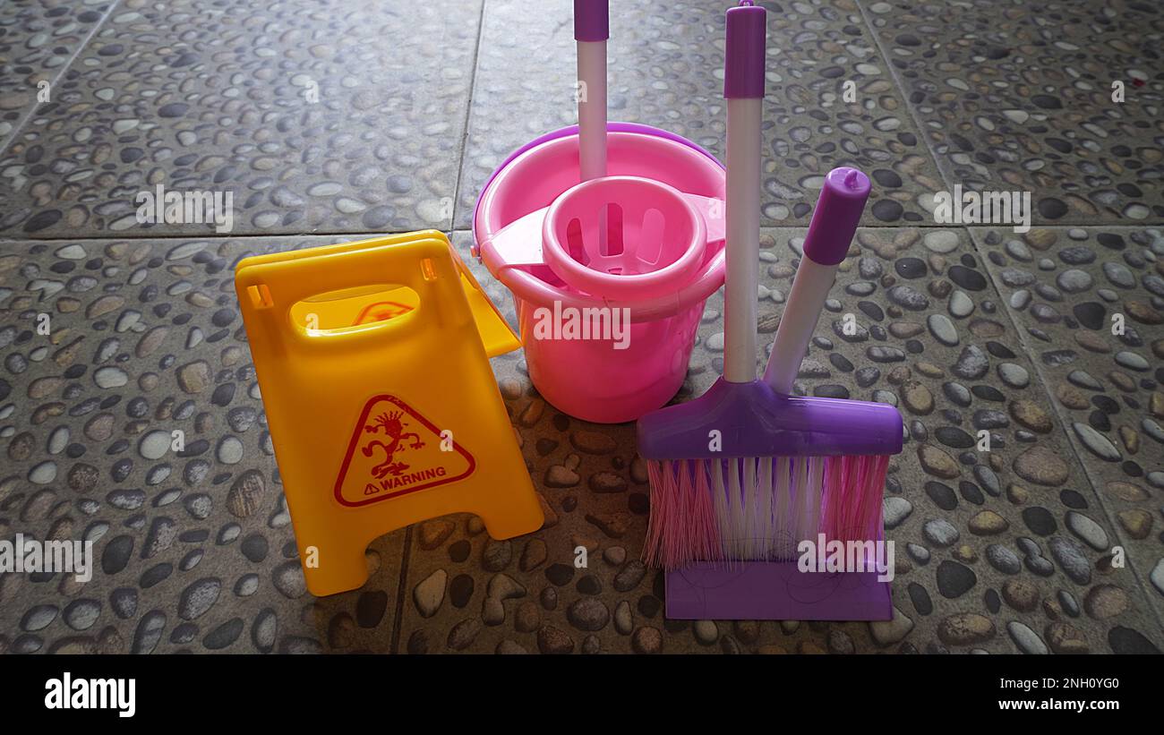 Children's games cleaning tools toy with warning wet signs as a means ...