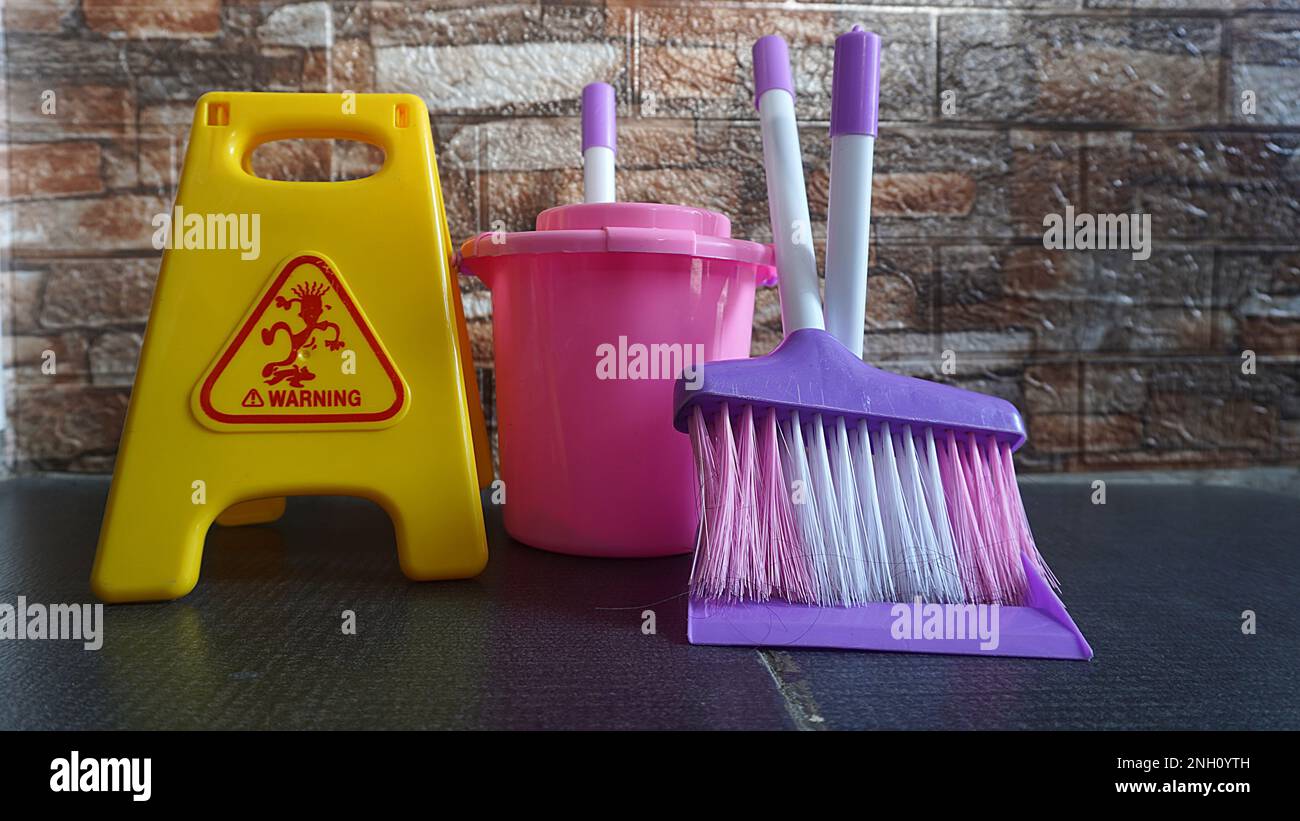 Children's games cleaning tools toy with warning wet signs as a means ...