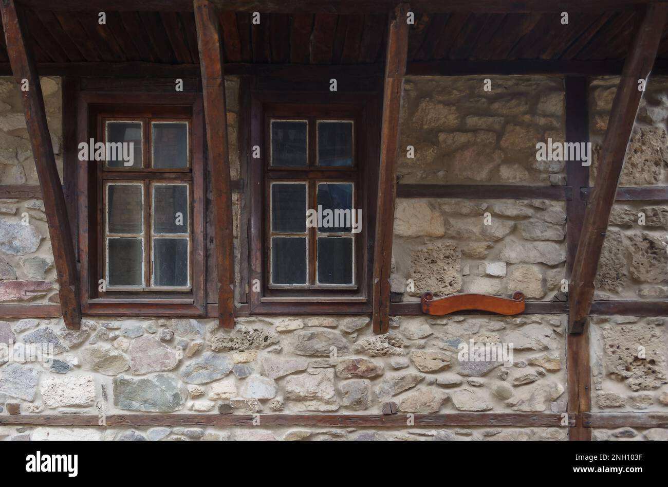 medieval windows on the stone wall. traditional old balkan architecture Stock Photo - Alamy