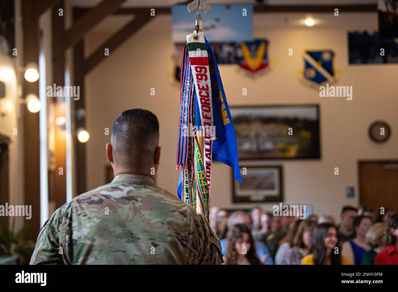 U.S. Air Force Master Sgt. Ron Olaes acts as guidon bearer for the 81st ...