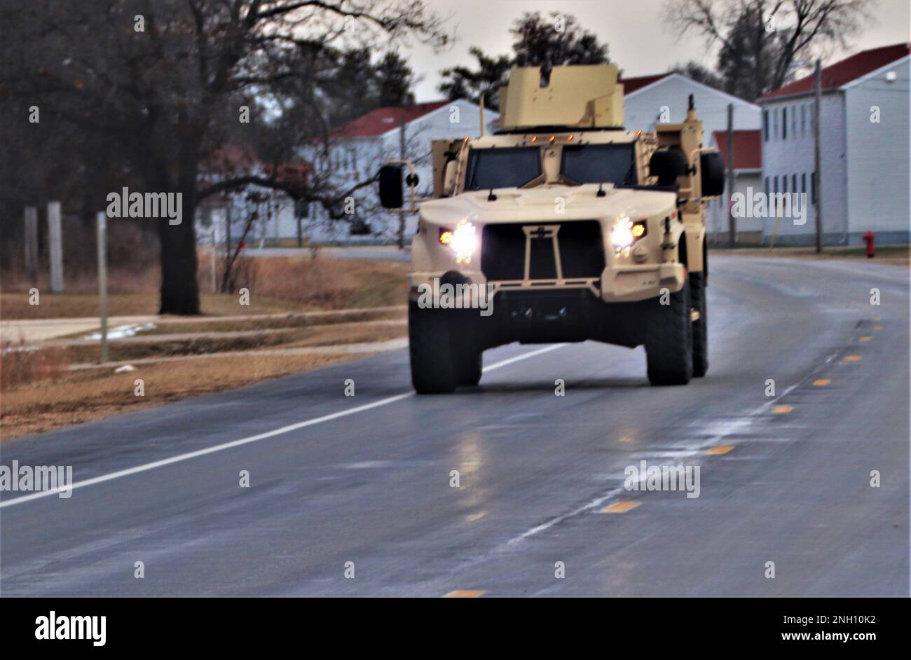 Personnel drive a Joint Light Tactical Vehicle (JLTV) through the ...