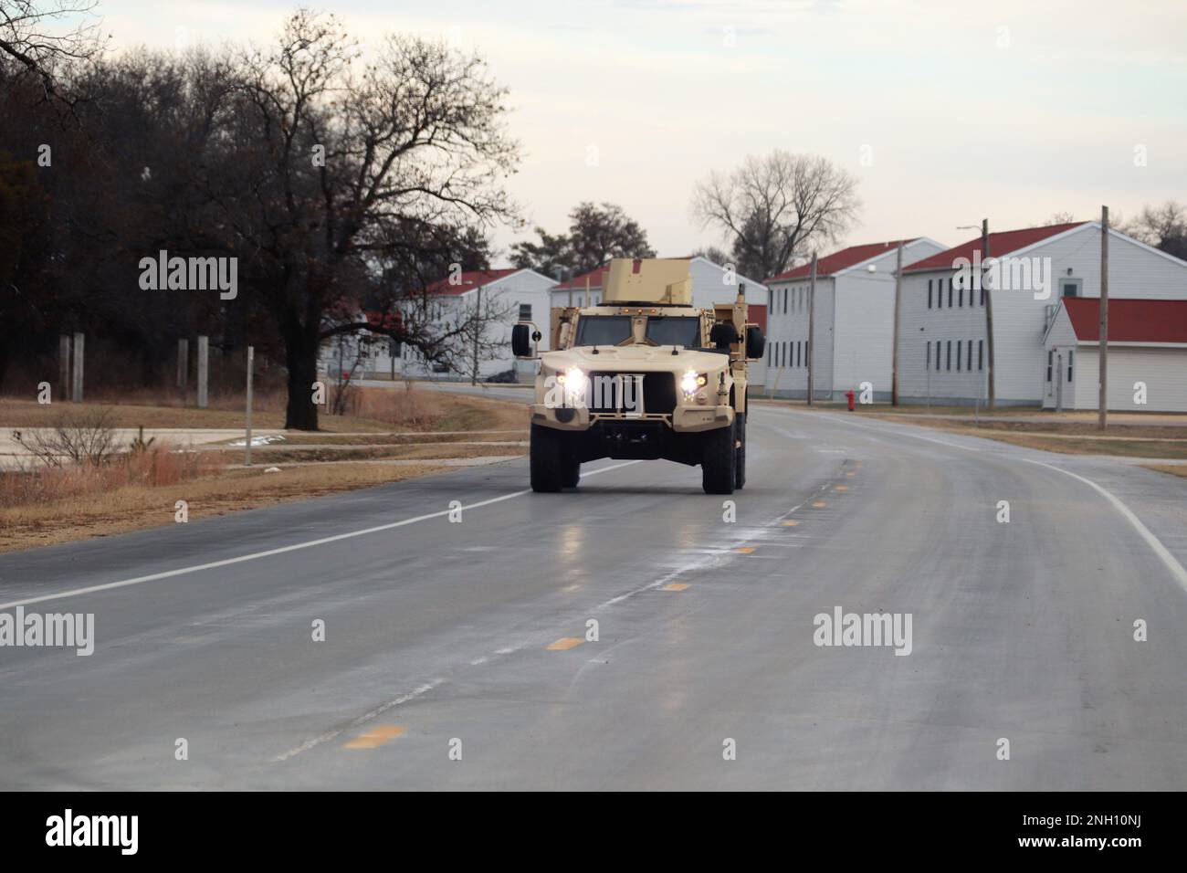 Personnel drive a Joint Light Tactical Vehicle (JLTV) through the ...