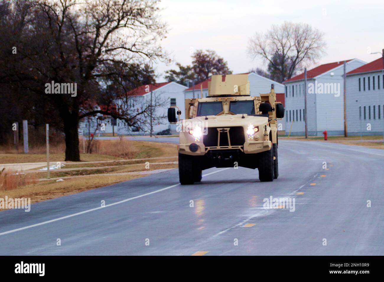 Personnel drive a Joint Light Tactical Vehicle (JLTV) through the ...