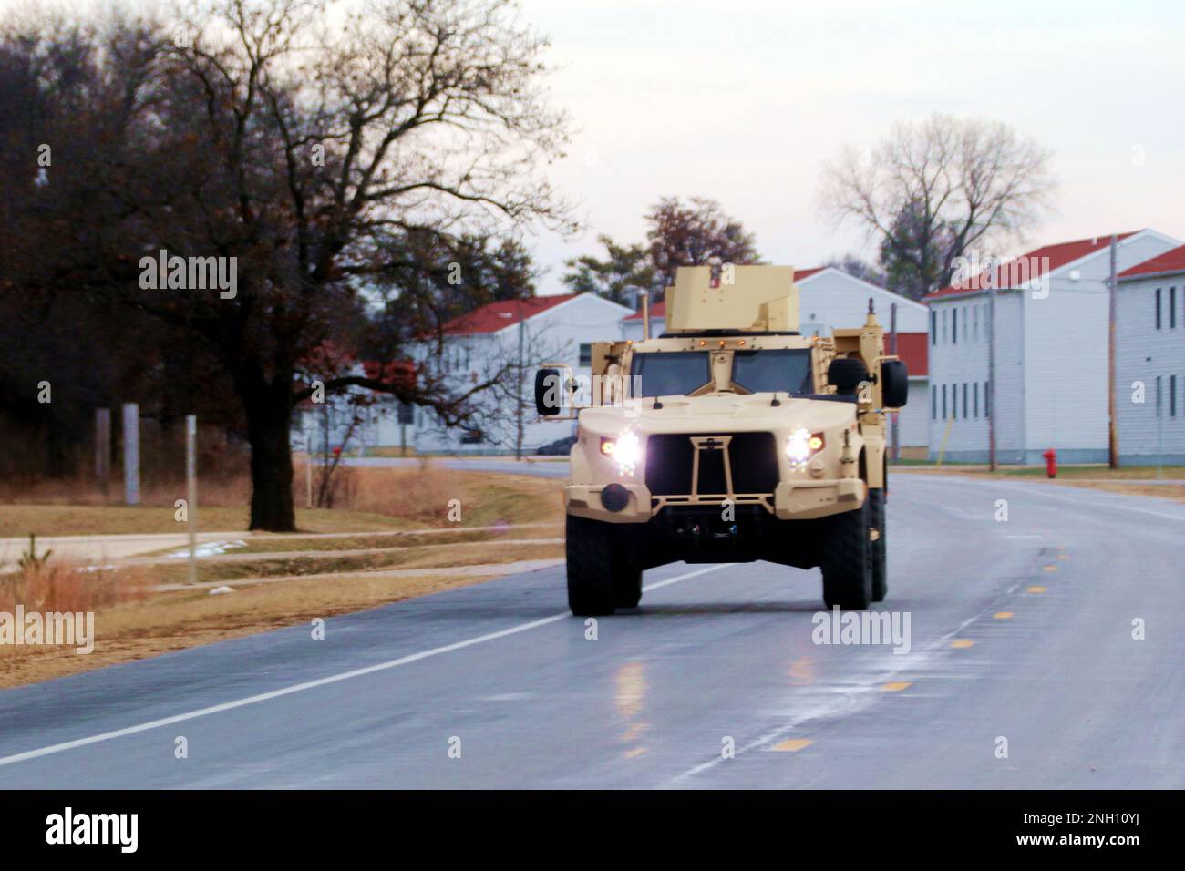 Personnel drive a Joint Light Tactical Vehicle (JLTV) through the ...