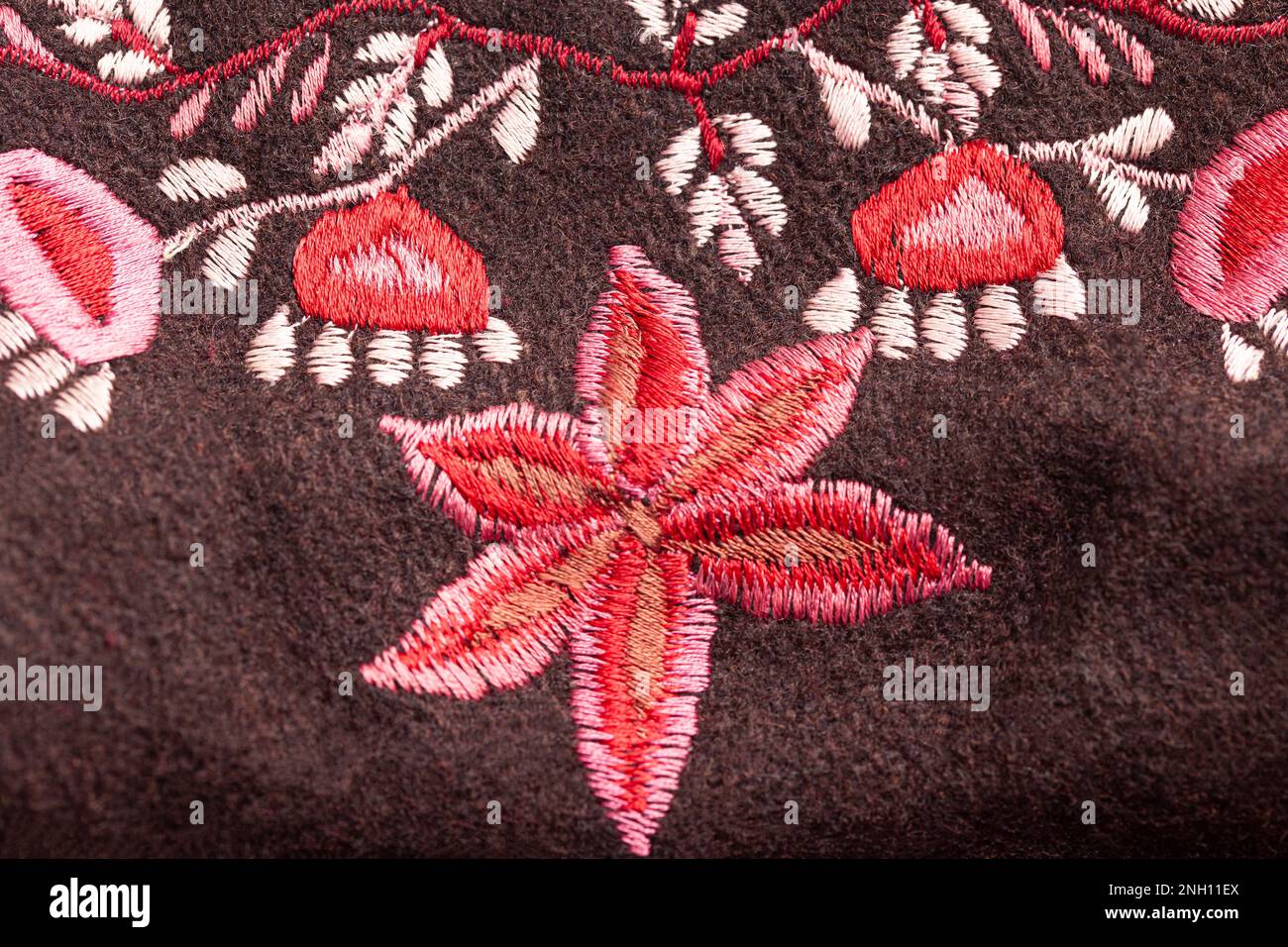 Texture of brown wool fabric with hand embroidery. Material for winter ...