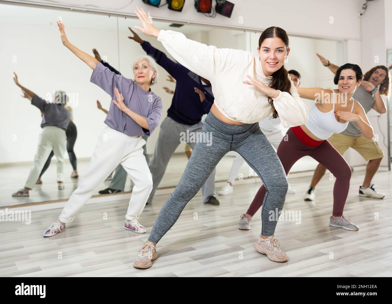 Group of adult people practices dance aerobics Stock Photo - Alamy