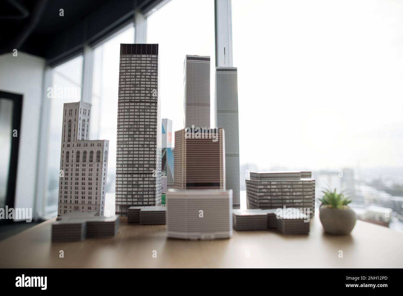 Architectural bureau office with panoramic windows and blurry cityscape ...