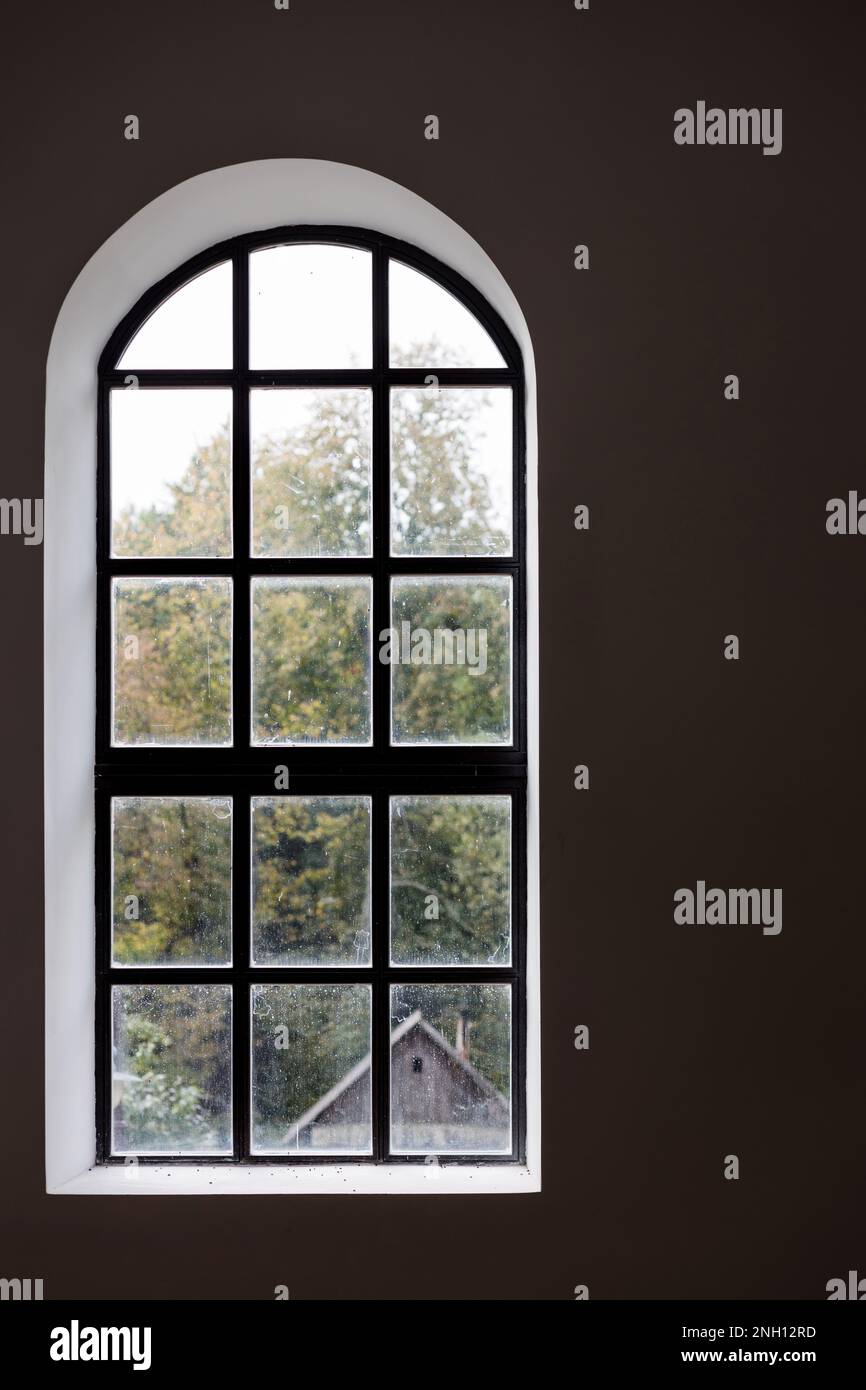 Dark interior with large rustic window. Old fashioned vintage home ...